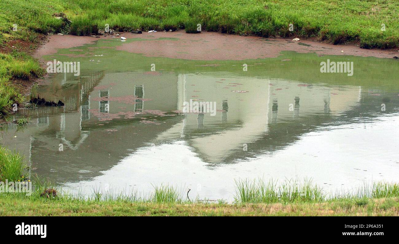 HIGH POINT, NC : A pond off in High Point, N.C., has begun to show ...