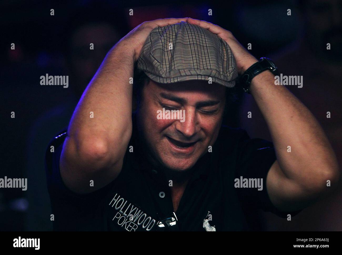 Actor Kevin Pollack reacts after going "all in" and doubling up his ...