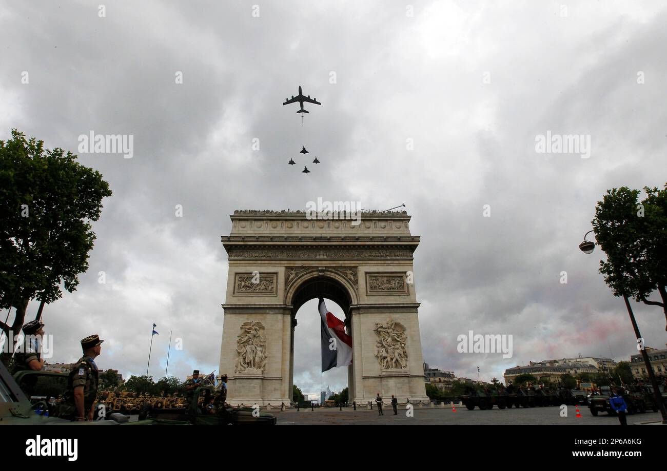French military planes fly over the Arc de Triomphe at the start of the ...