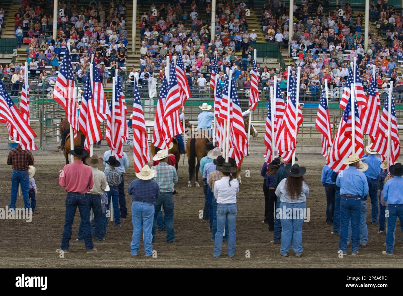 Men, women and children stand Friday evening July 13, 2012 after ...