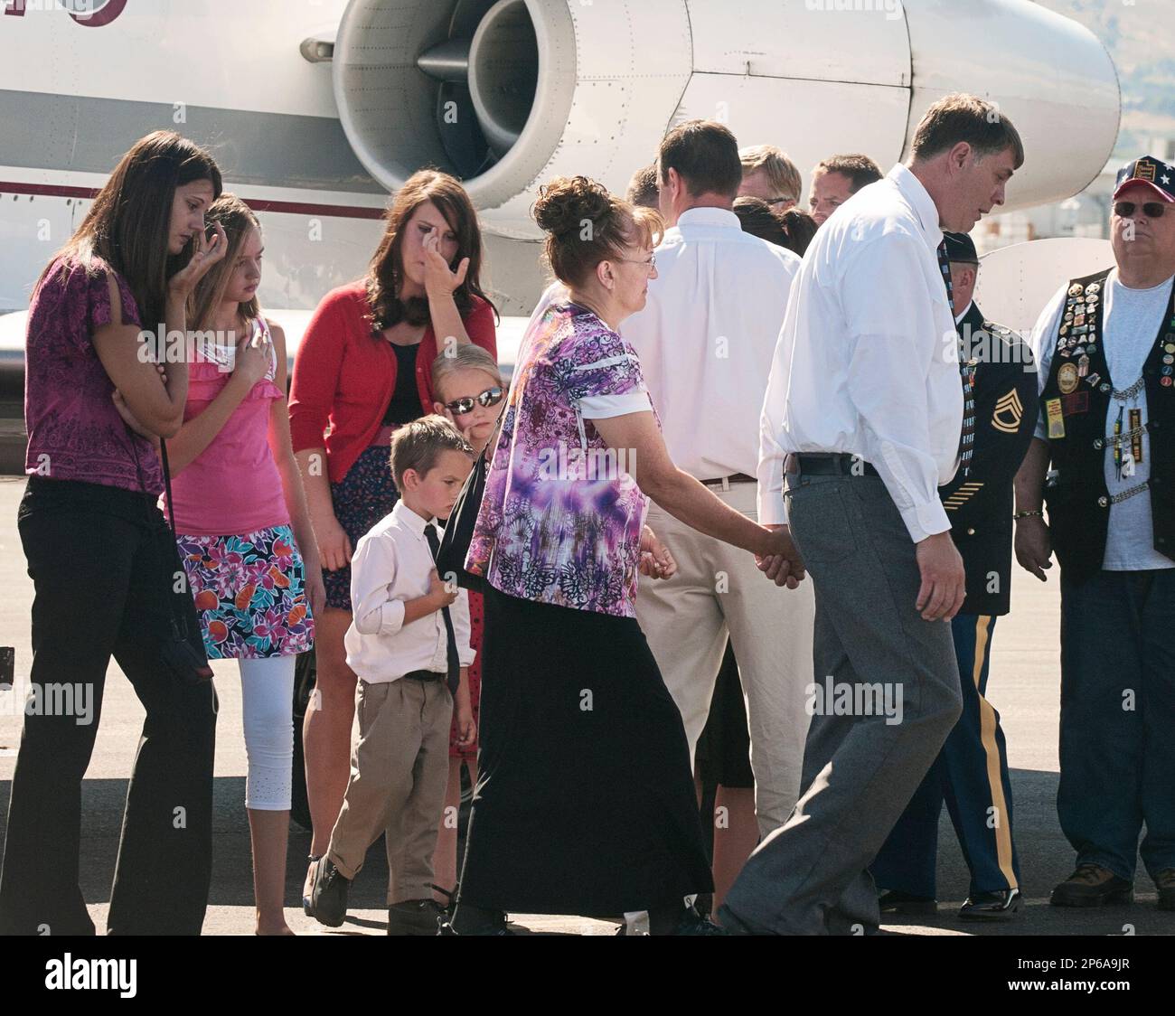 Family members of Spc. Cody O. Moosman return from approaching his ...