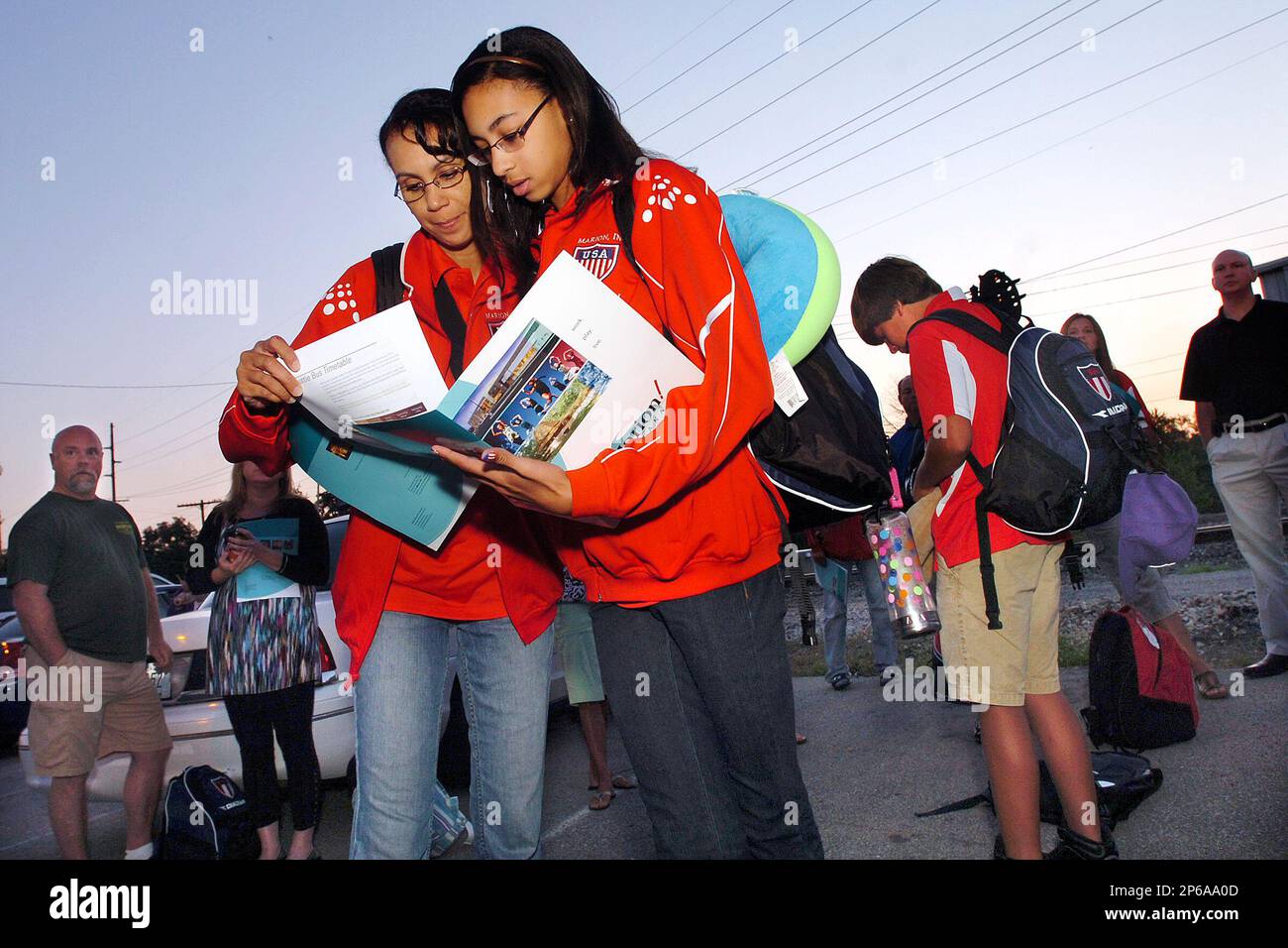 Latrese Moffitt, left, and her daughter, Janae, 15, look over travel ...