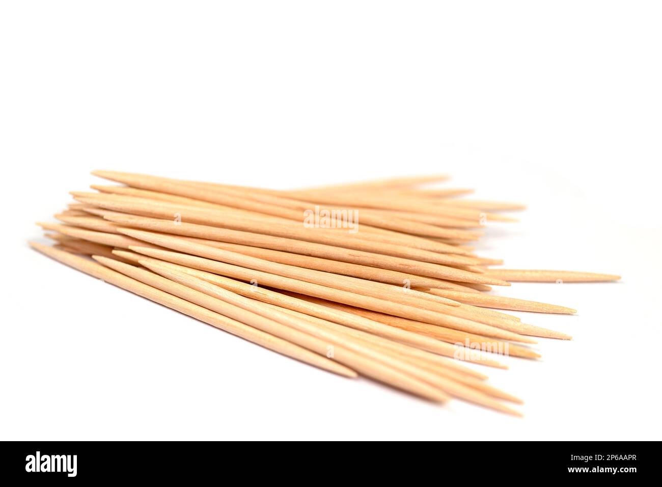 Wooden toothpicks against white background Stock Photo - Alamy