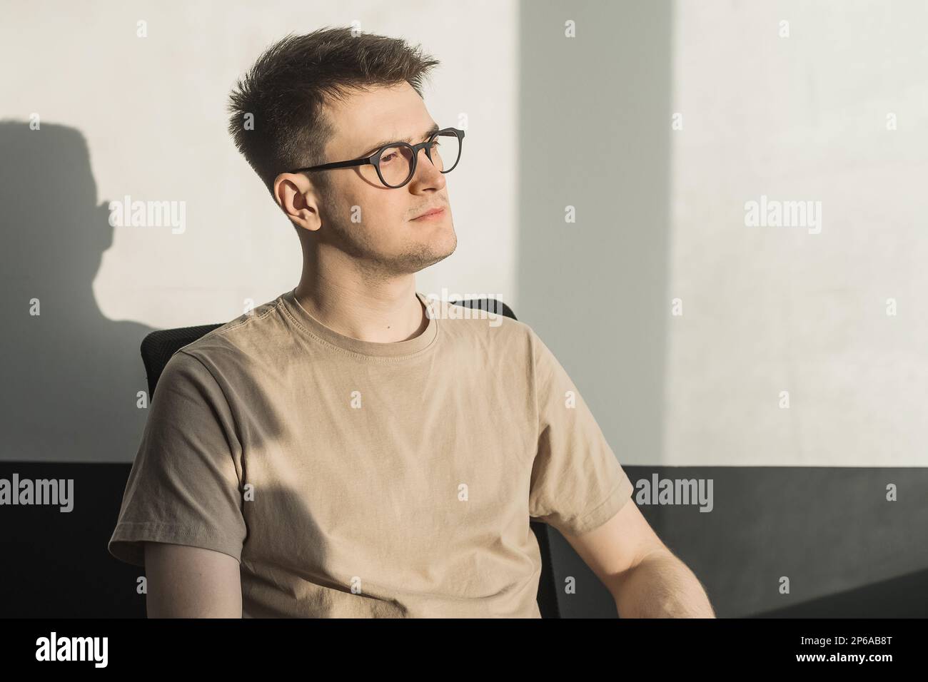 Portrait of a serious millennial male business owner in modern office ...