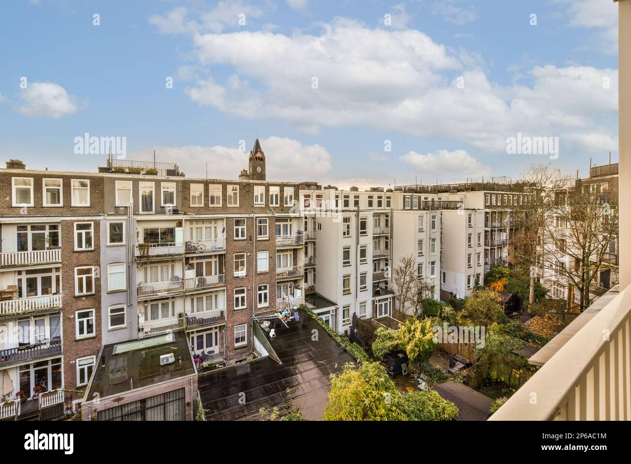 an outside area with buildings and trees in the foregrounds, taken from ...