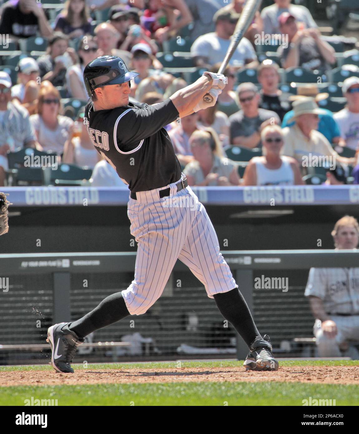 Colorado Rockies third baseman Jordan Pacheco (22) swings at the pitch ...