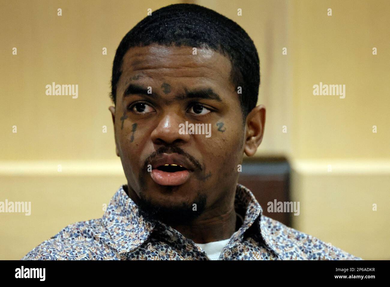 Suspected shooting accomplice Dedrick Williams speaks to someone in the ...