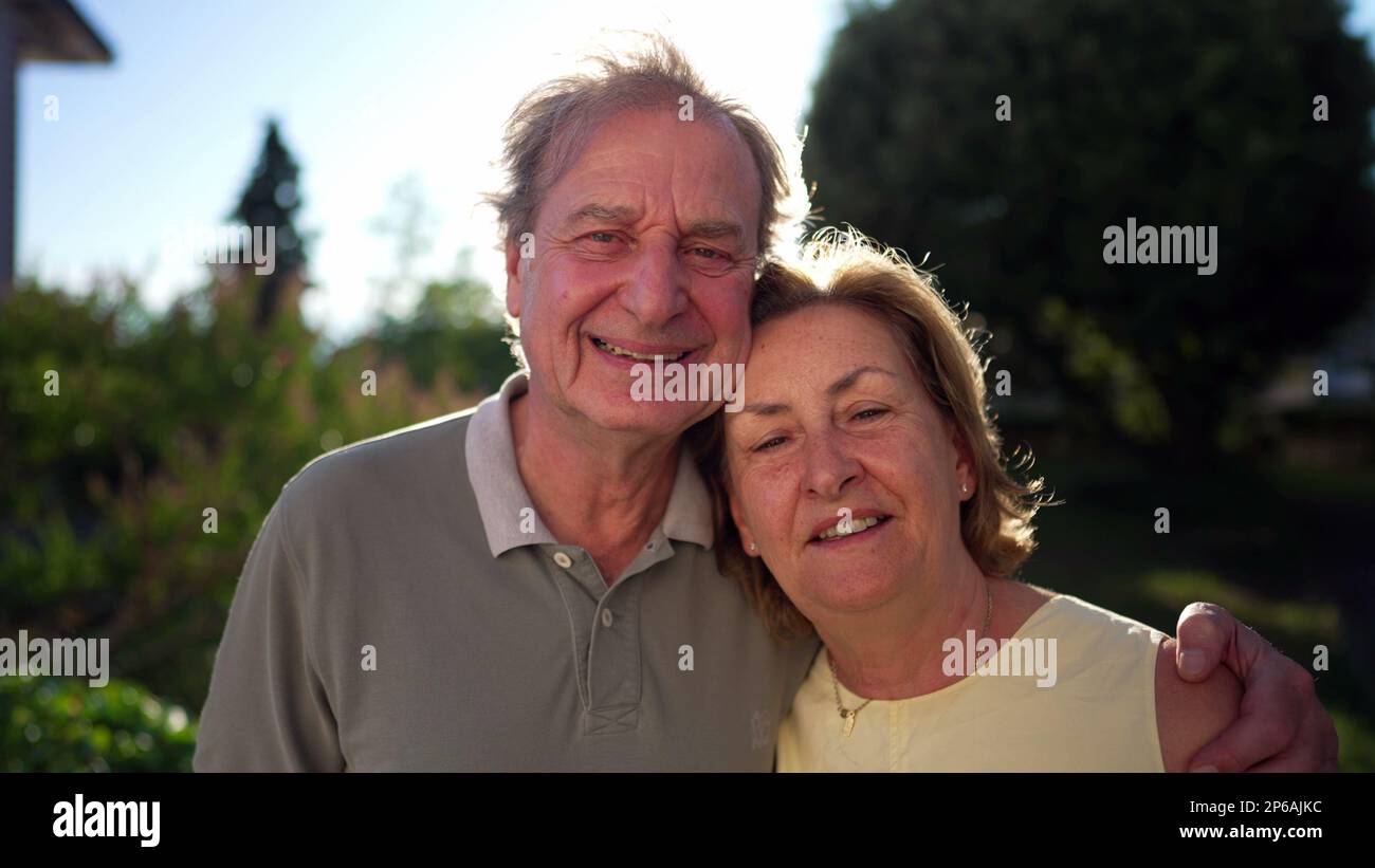 Two joyful older people smiling and laughing at camera. A senior ...