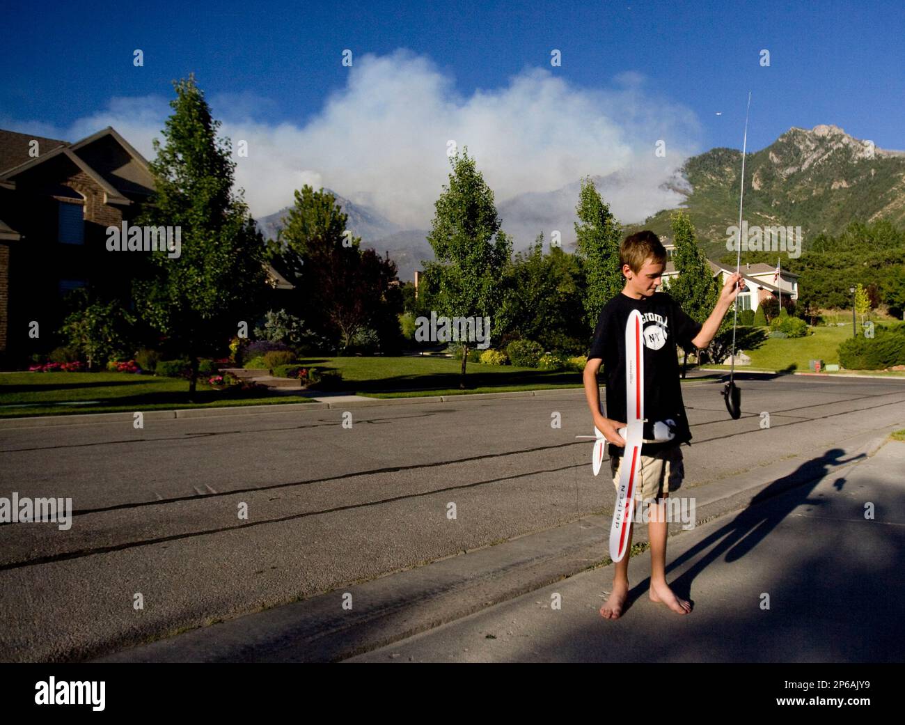 Brendon Boyd plays with a model plane similar to the ones used to ...