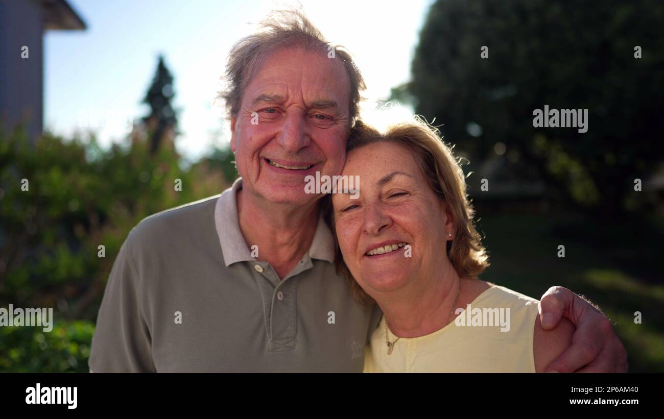 Two joyful older people smiling and laughing at camera. A senior ...