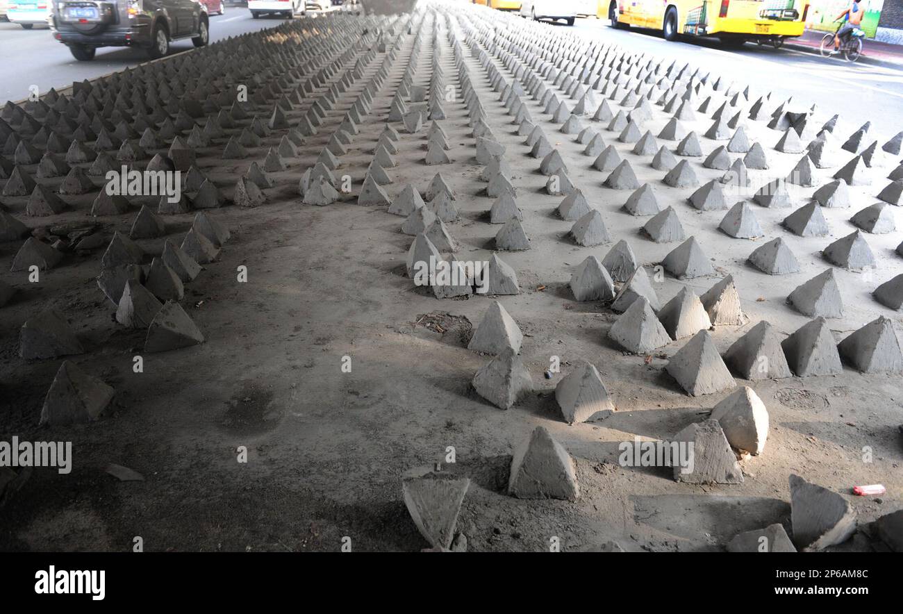 Large amounts of pyramid shaped cement blocks were built under overline ...