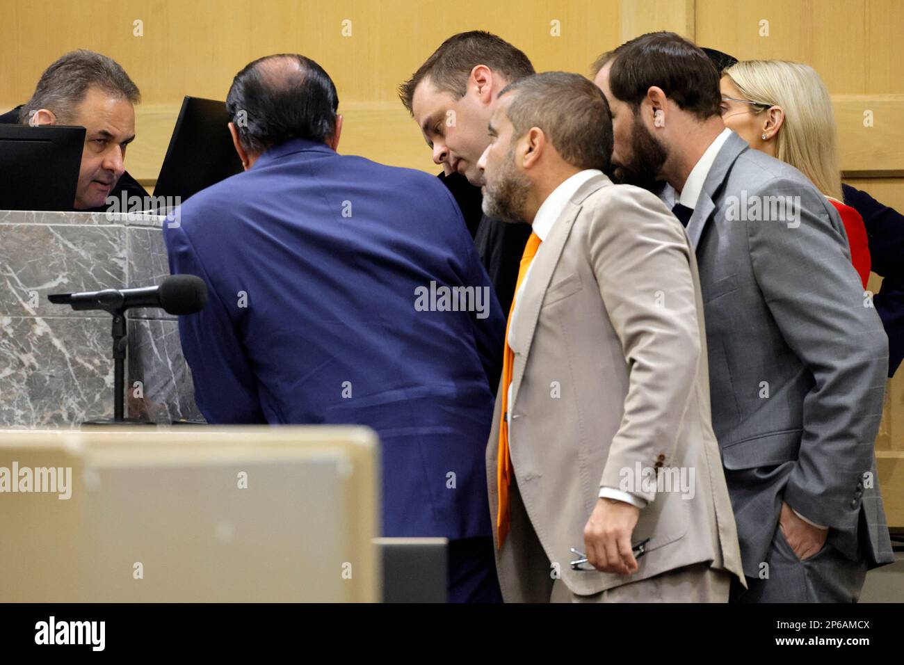 Attorneys meet with Judge Michael Usan for a sidebar discussion during ...