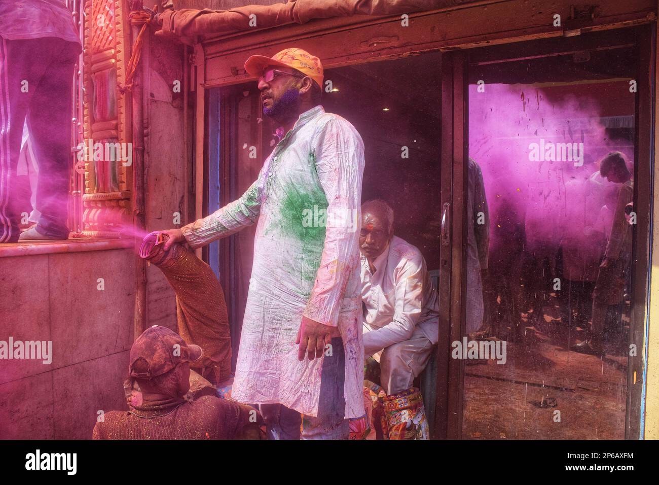 A man plays with colorful powders during the Holi festival. Holi is a ...