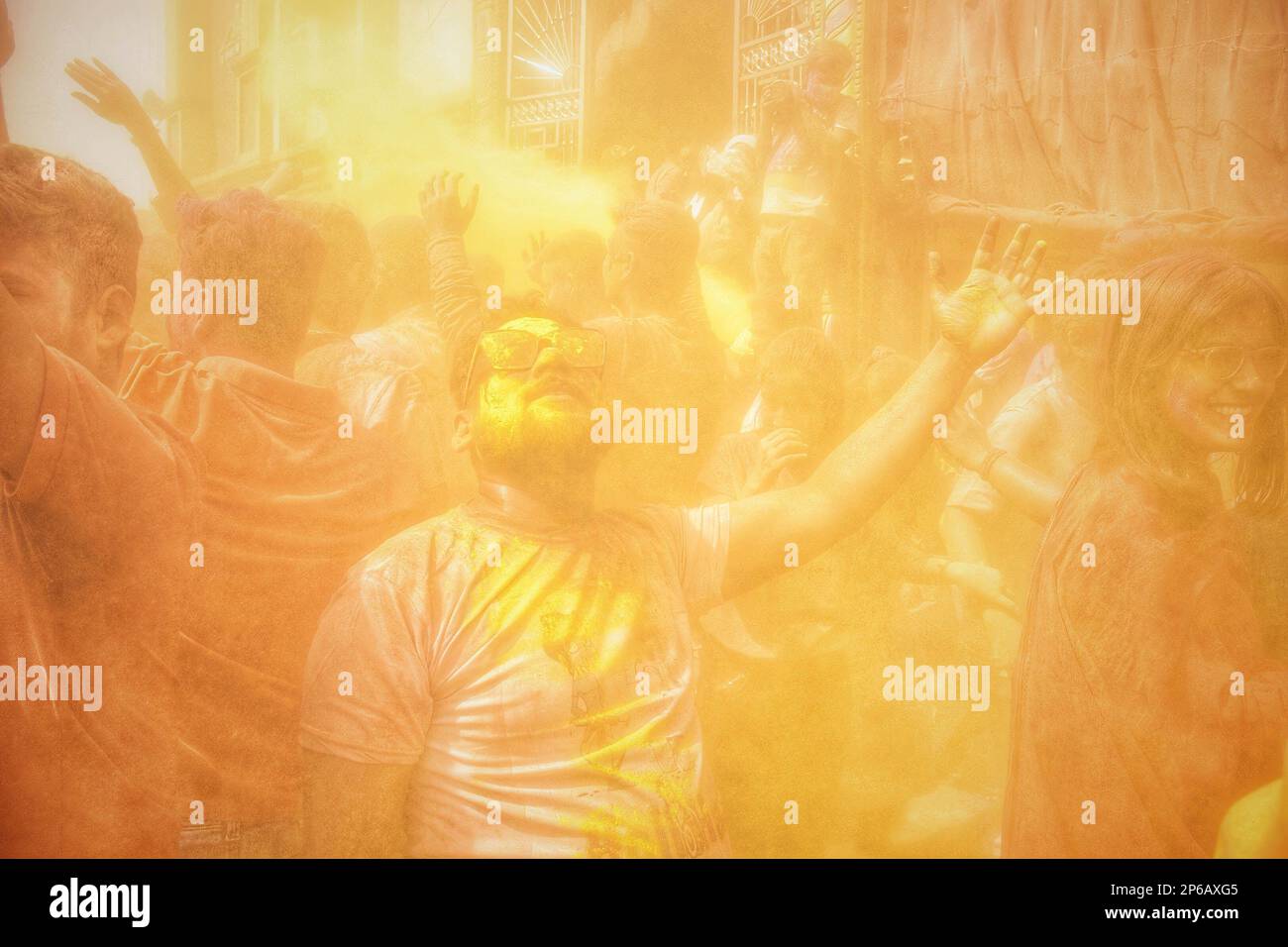 People play with colorful powders during the Holi festival. Holi is a ...