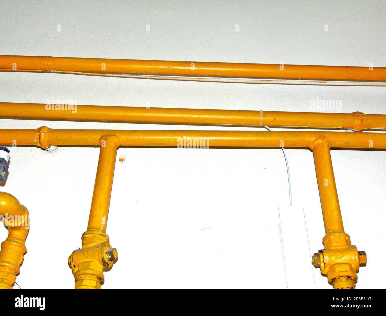 gas pipes on a wall Stock Photo - Alamy