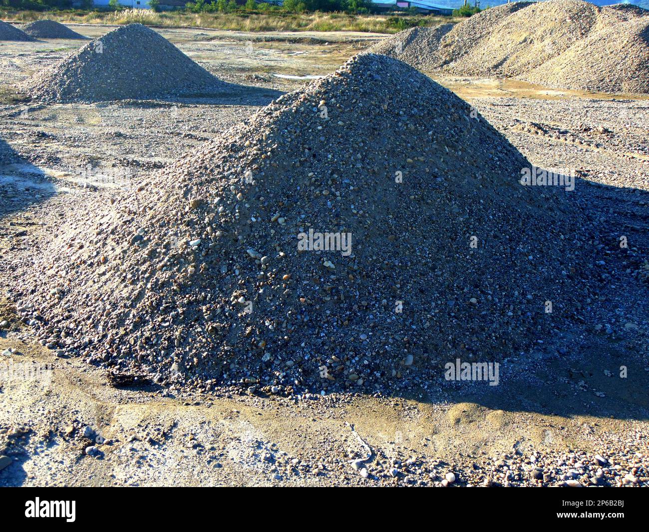 several piles of gravel for construction work Stock Photo - Alamy