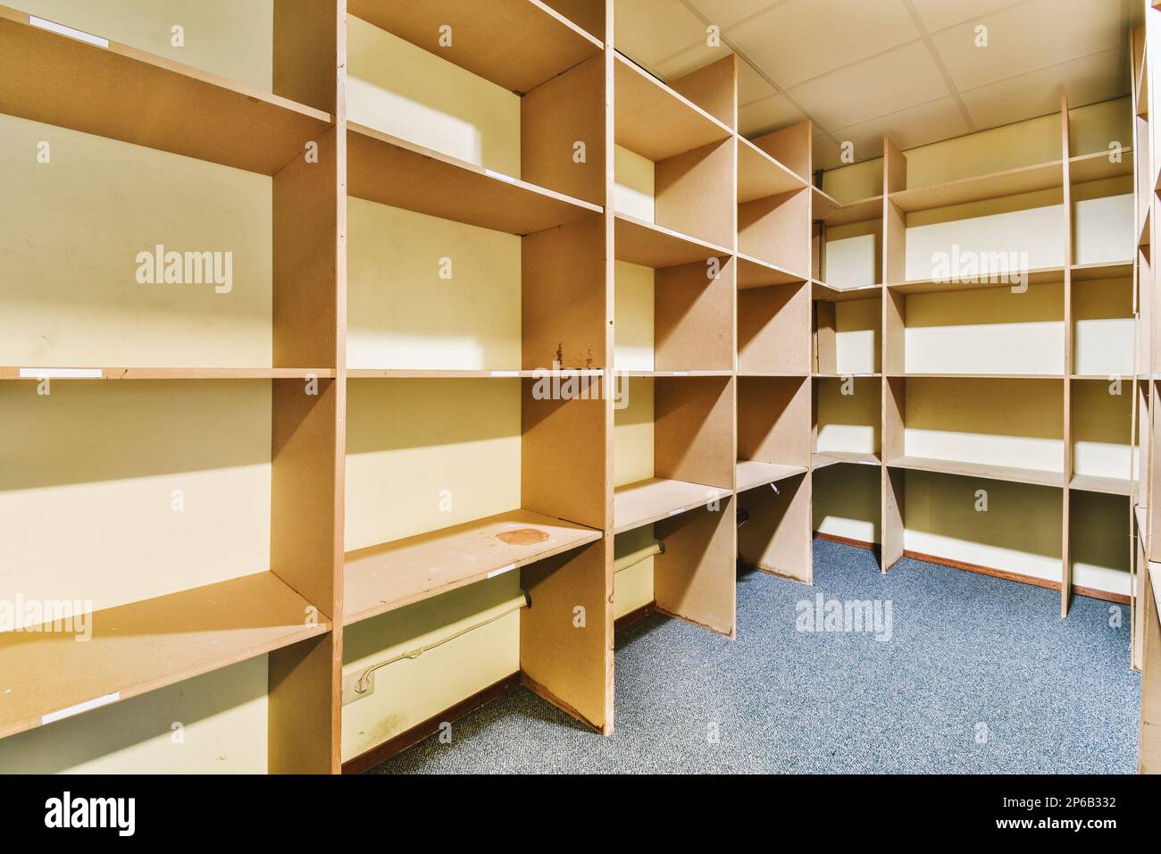 the inside of a room with many shelves on each side and one shelf at ...