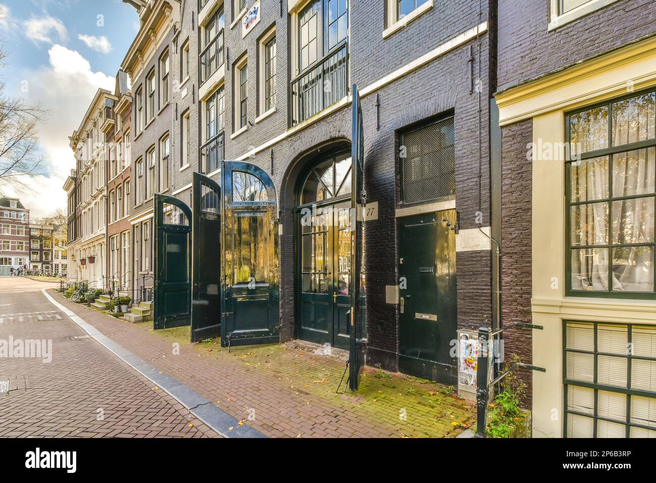 Amsterdam, Netherlands - 10 April, 2021: a city street with buildings ...