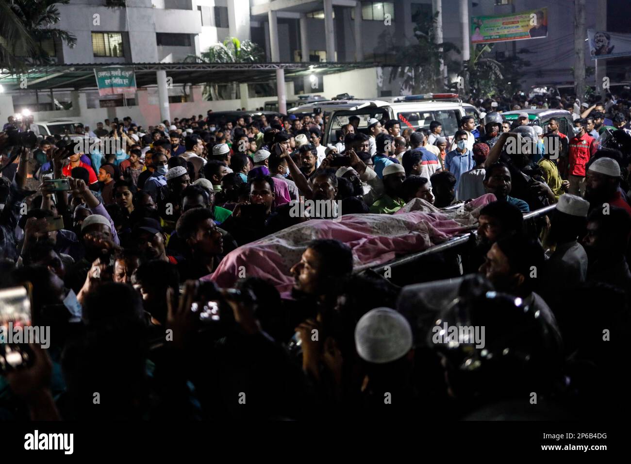 Dhaka, Bangladesh. 7th Mar, 2023. Relatives are taking away the body ...