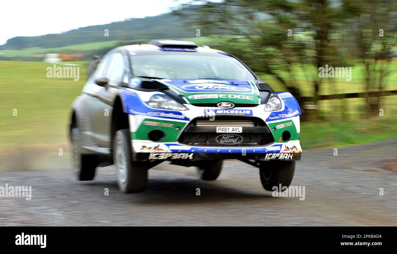 Jari-Matti Latvala (FIN) and co driver Mikko Antila (FIN) crest a rise ...