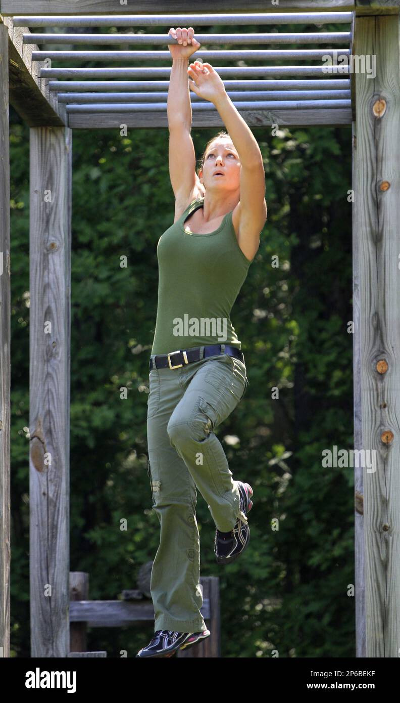 Deanna Jarrett-Gramling from Cherokee County, Ga., works her way across ...