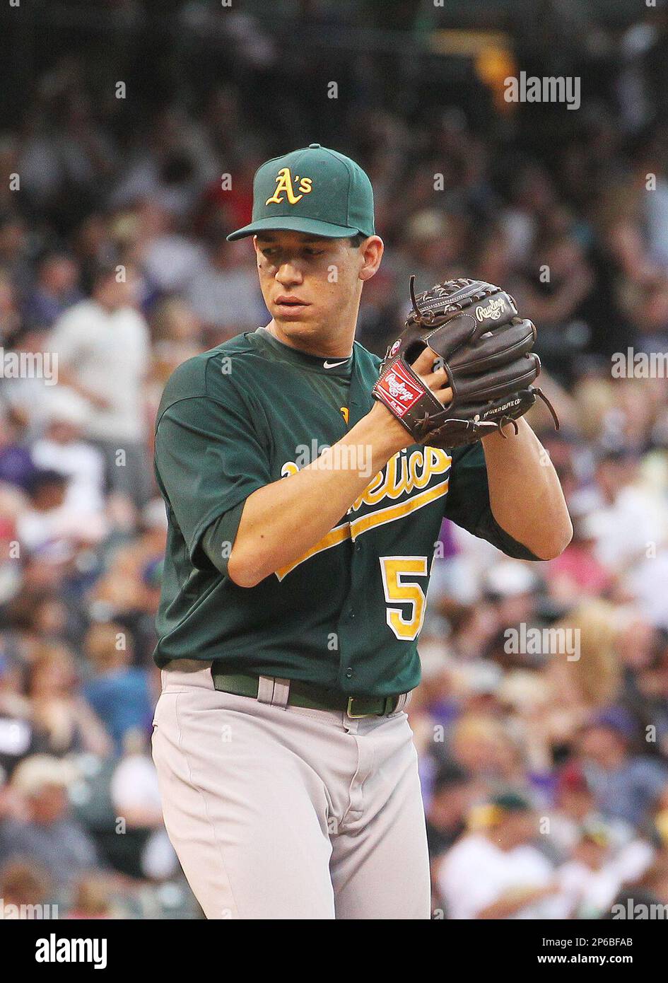 Oakland Athletics starting pitcher Tommy Milone (57) warms up in a game ...
