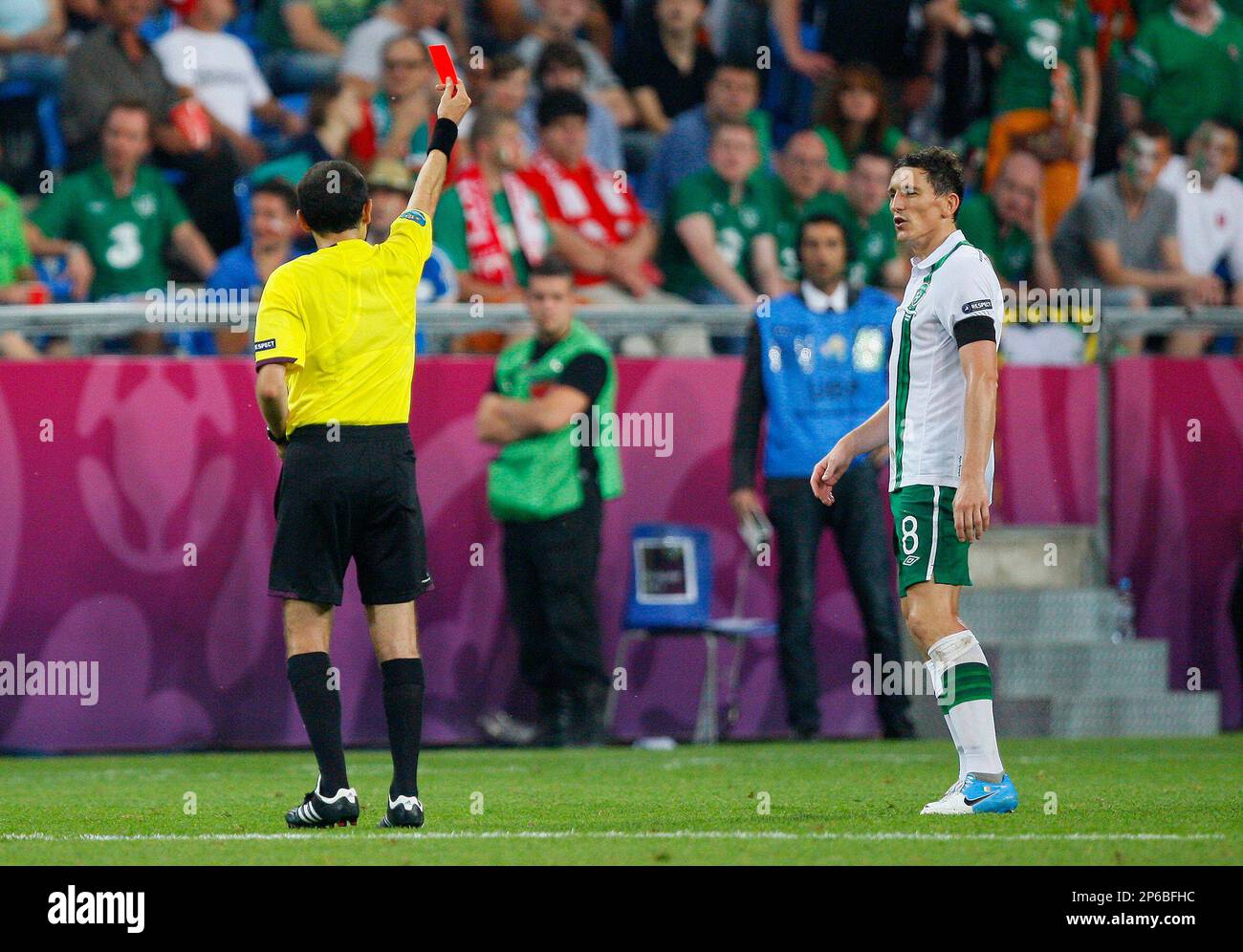 Keith Andrews of Republic of Ireland is shown a red cared by referee ...