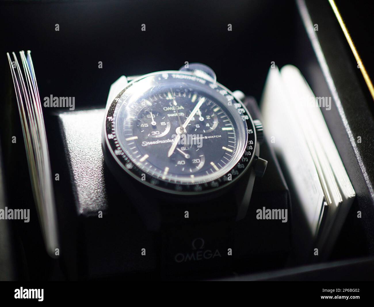 Customers look at the new MoonSwatch during the launch at the Swatch ...