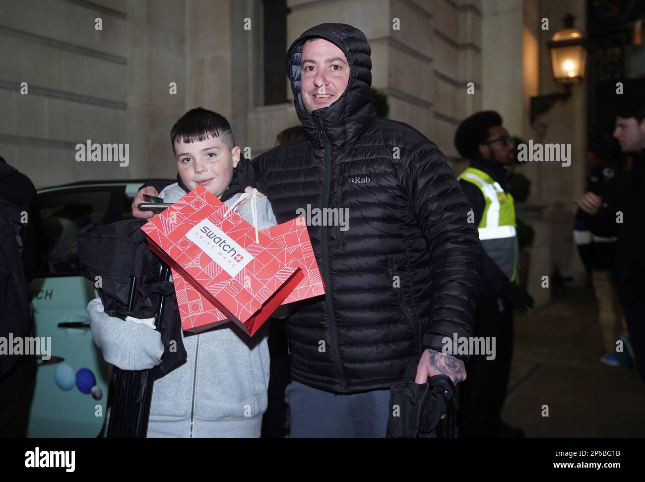Customers with their new MoonSwatch during the launch at the Swatch ...