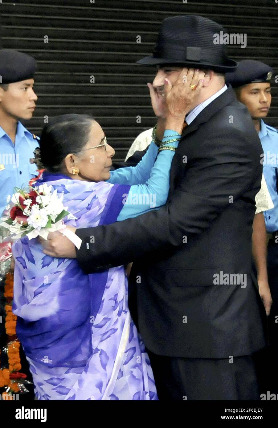 Govinda Prasad Mainali (R) is reunited with his 79-year-old mother ...