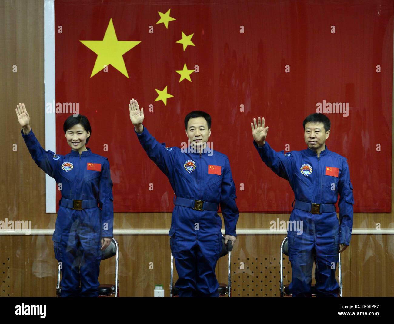 From left, Chinese astronauts Liu Yang, Jing Haipeng and Liu Wang wave ...