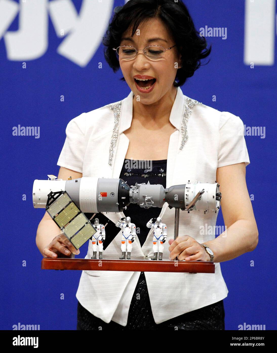 Wu ping, spokesperson for China's manned flight program, reacts as a ...