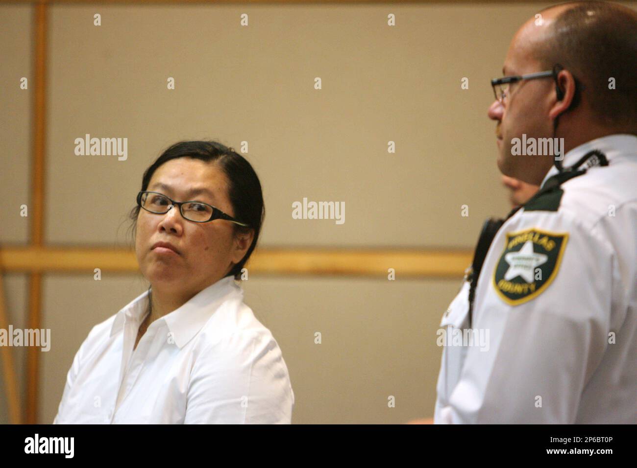 Arunya Rouch stands at the defense table at the Pinellas County ...