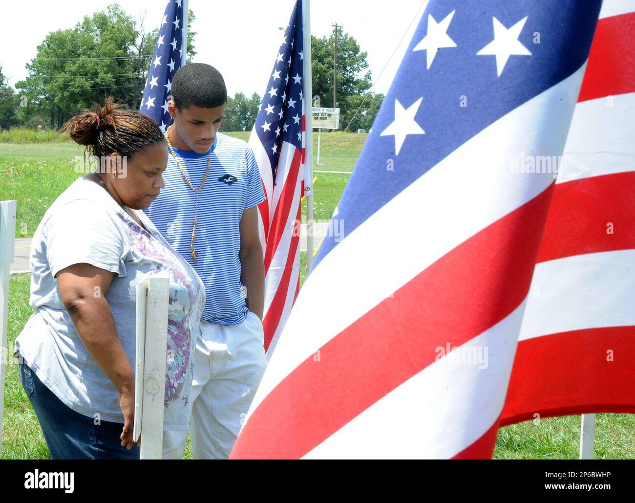 Catrinia Clark, left, and her son, Dequarius Bennett, walk through the ...