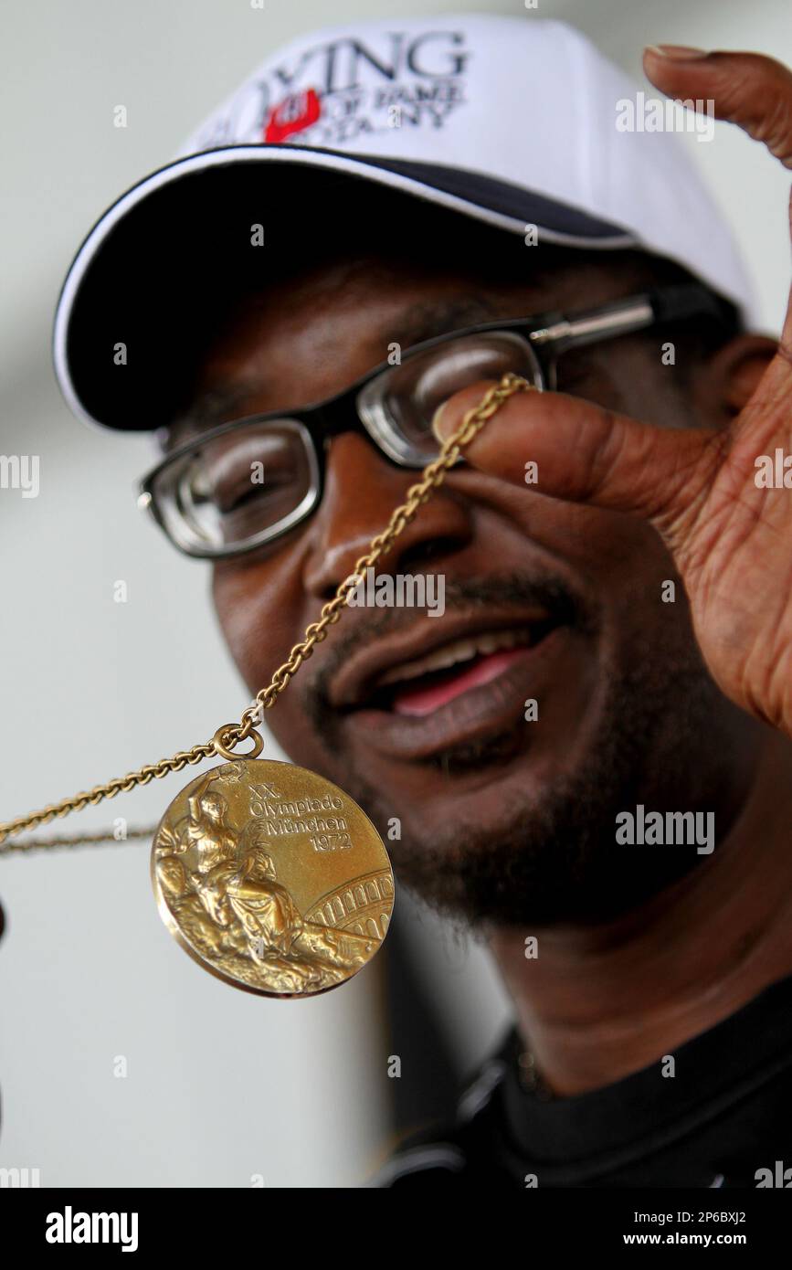 Boxer and 1972 Olympic Gold Medalist Sugar Ray Seales holds up his Gold ...