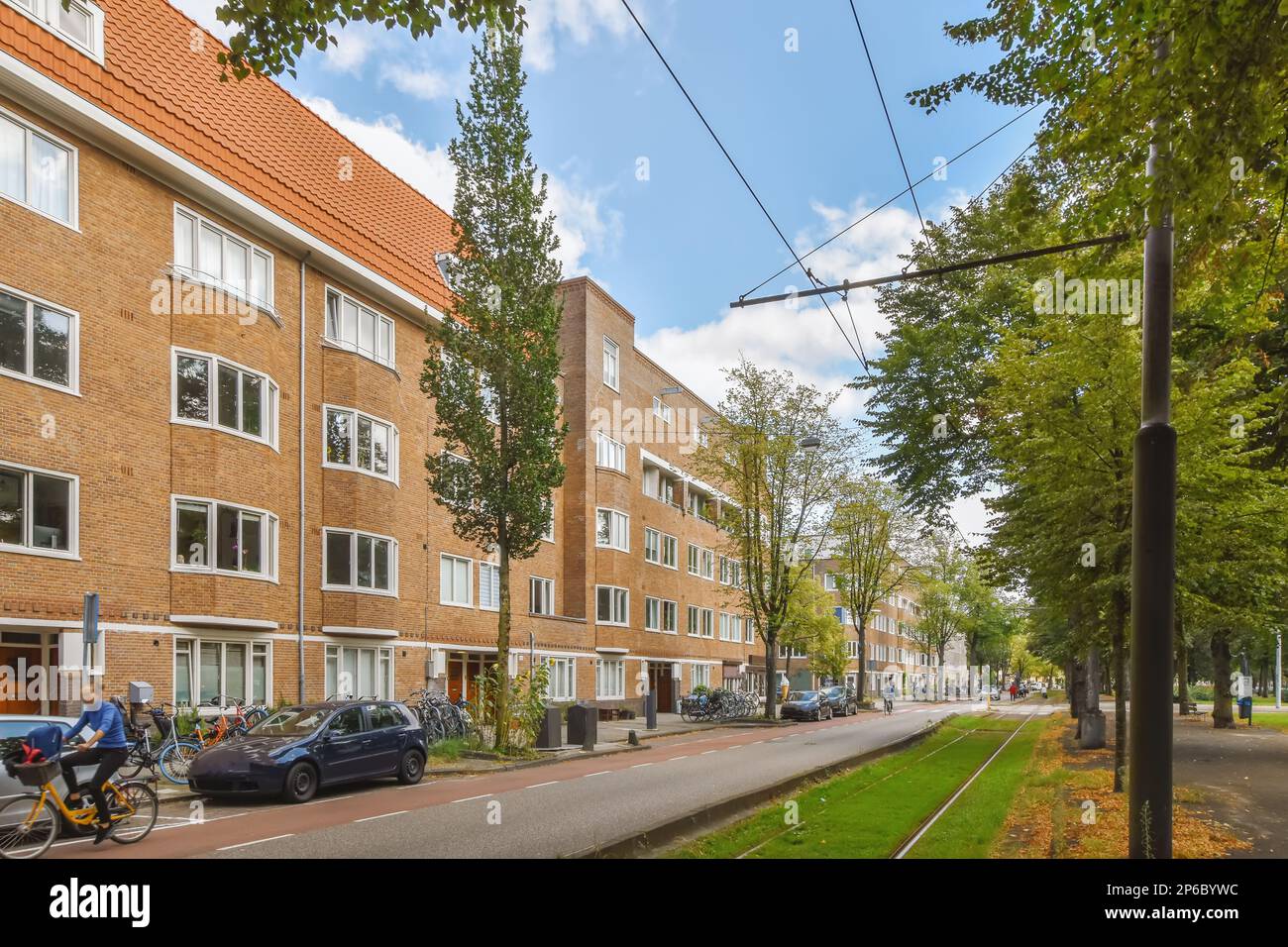 Amsterdam, Netherlands - 10 April, 2021: a city street with cars parked ...
