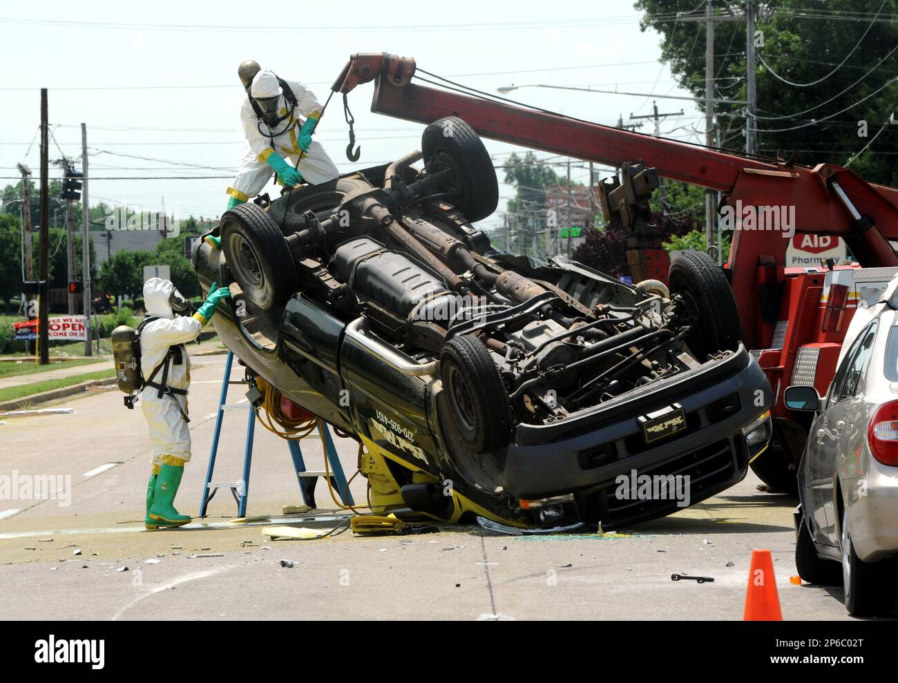 Suited up in a Tyvek Level B HazMat suit, Owensboro firefighter Patrick ...