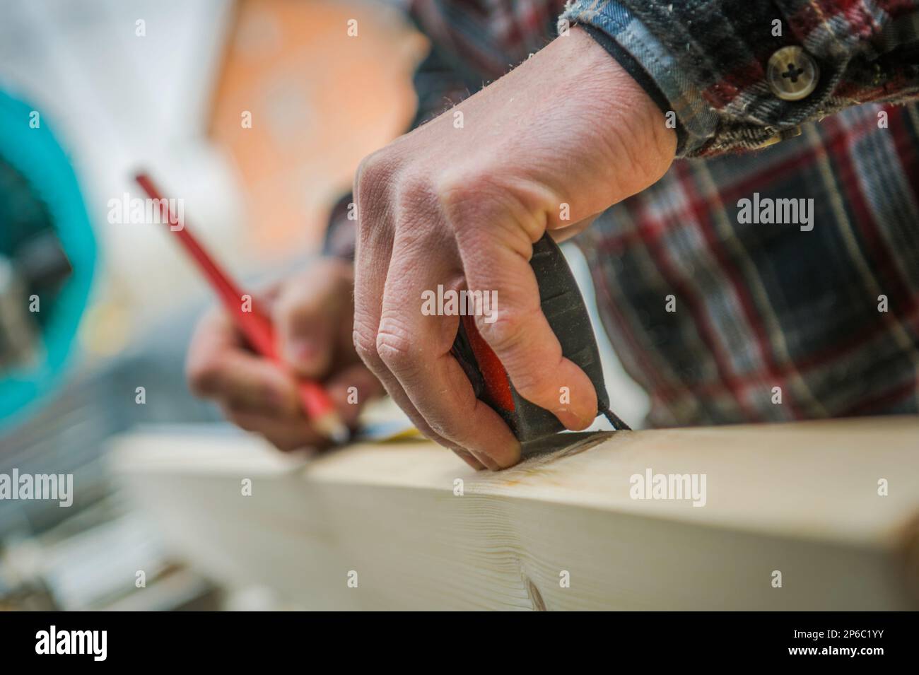 Construction Woodworker Measuring Piece of Wood Material. Marking Cut ...