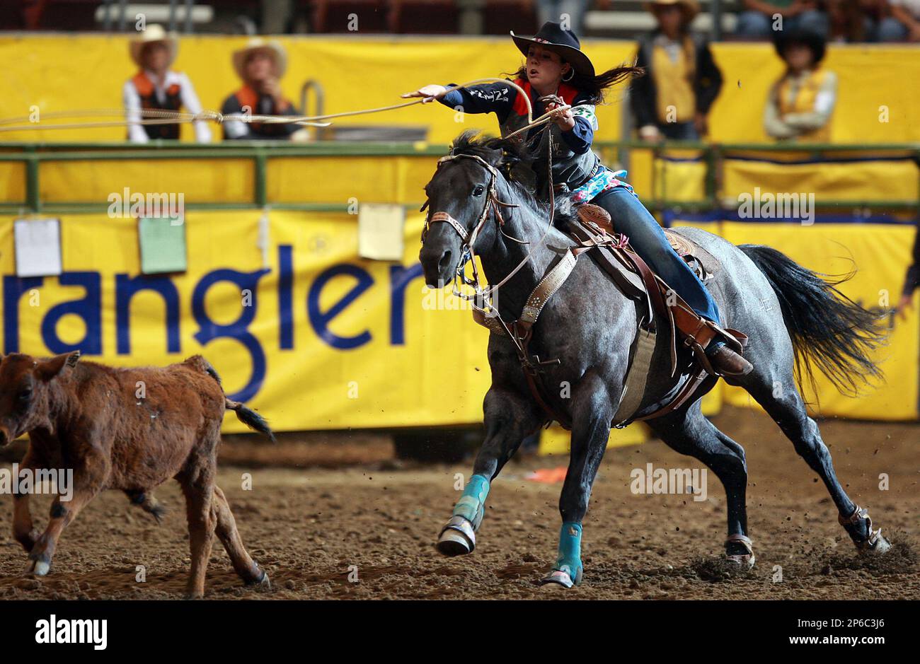 Northwest College breakaway roper Heather Knerr runs down a calf ...