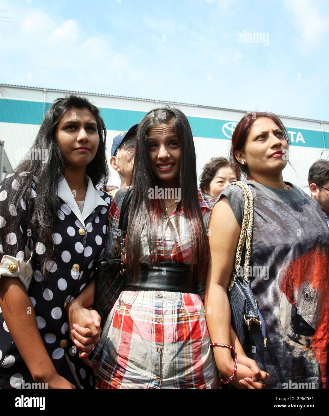 Family members of Govinda Prasad Mainali (R-L) Radha, his wife and his ...