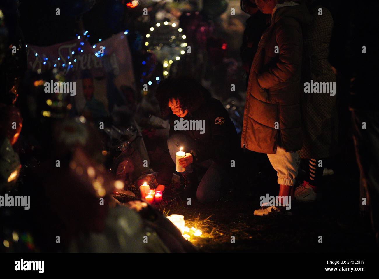 People attend a vigil in the St Mellons area of Cardiff, in memory of ...