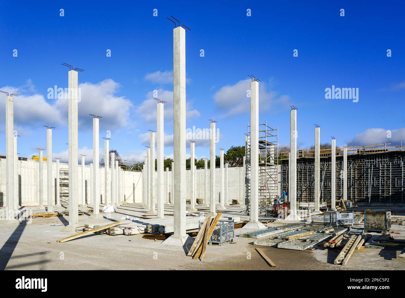 Many white vertical reinforced concrete columns at the construction ...