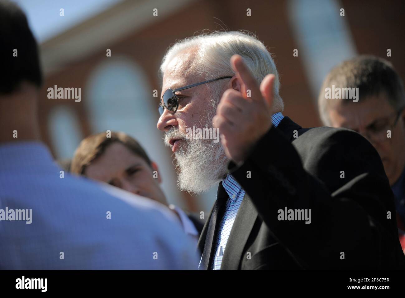 Defense attorney Daniel Hawes speaks with reporters after a bond ...