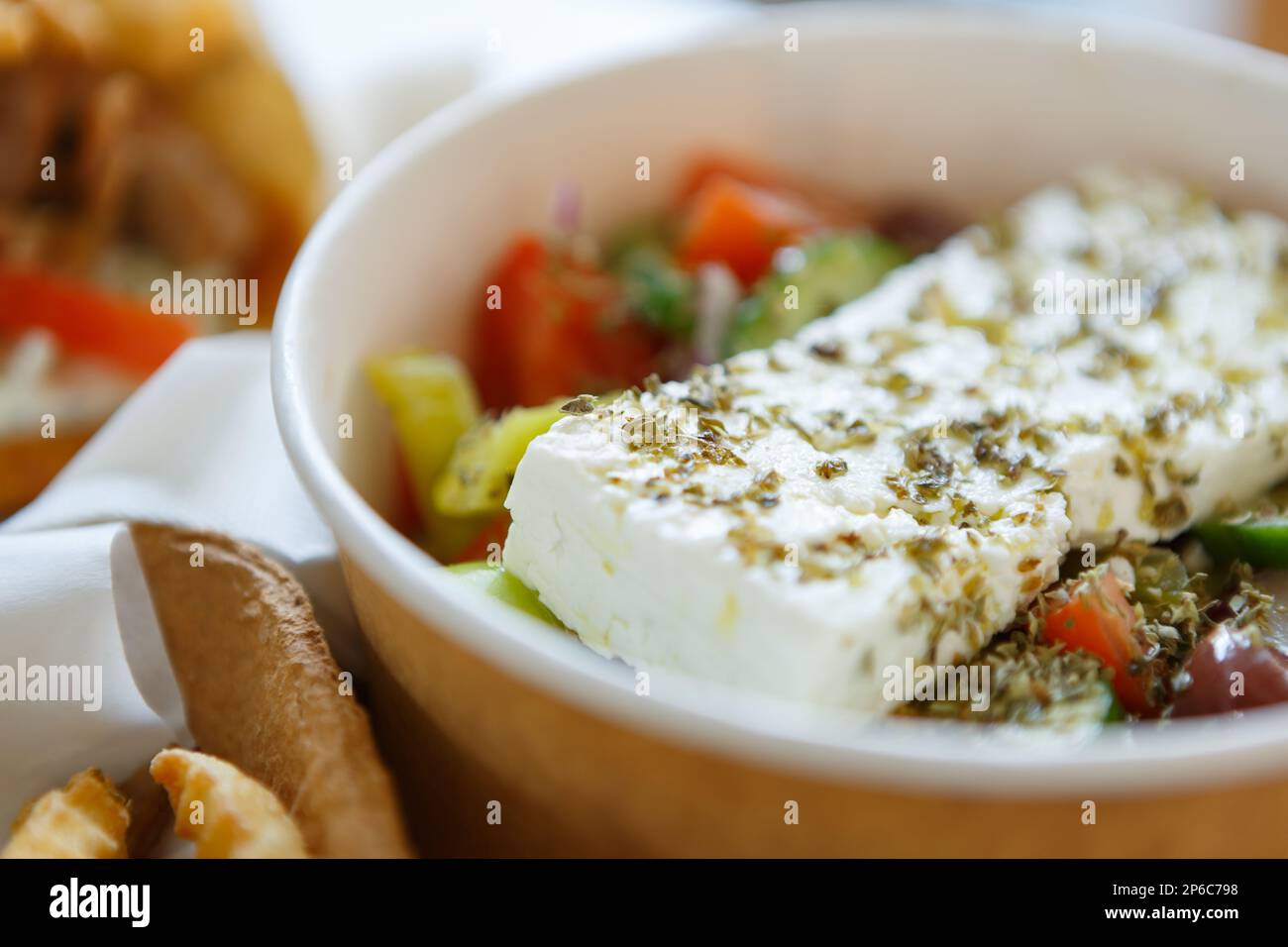 Traditional Greek salad with feta cheese, olive oil and fesh vegetables ...