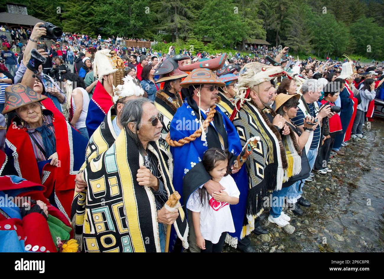 Members of the Auke Bay clan and hundreds of others greet seven canoes ...
