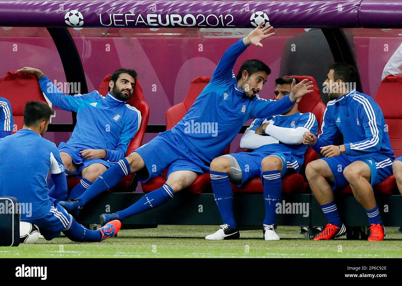 Greece's Nikos Lymberopoulos, center, jokes with teammates Grigoris ...