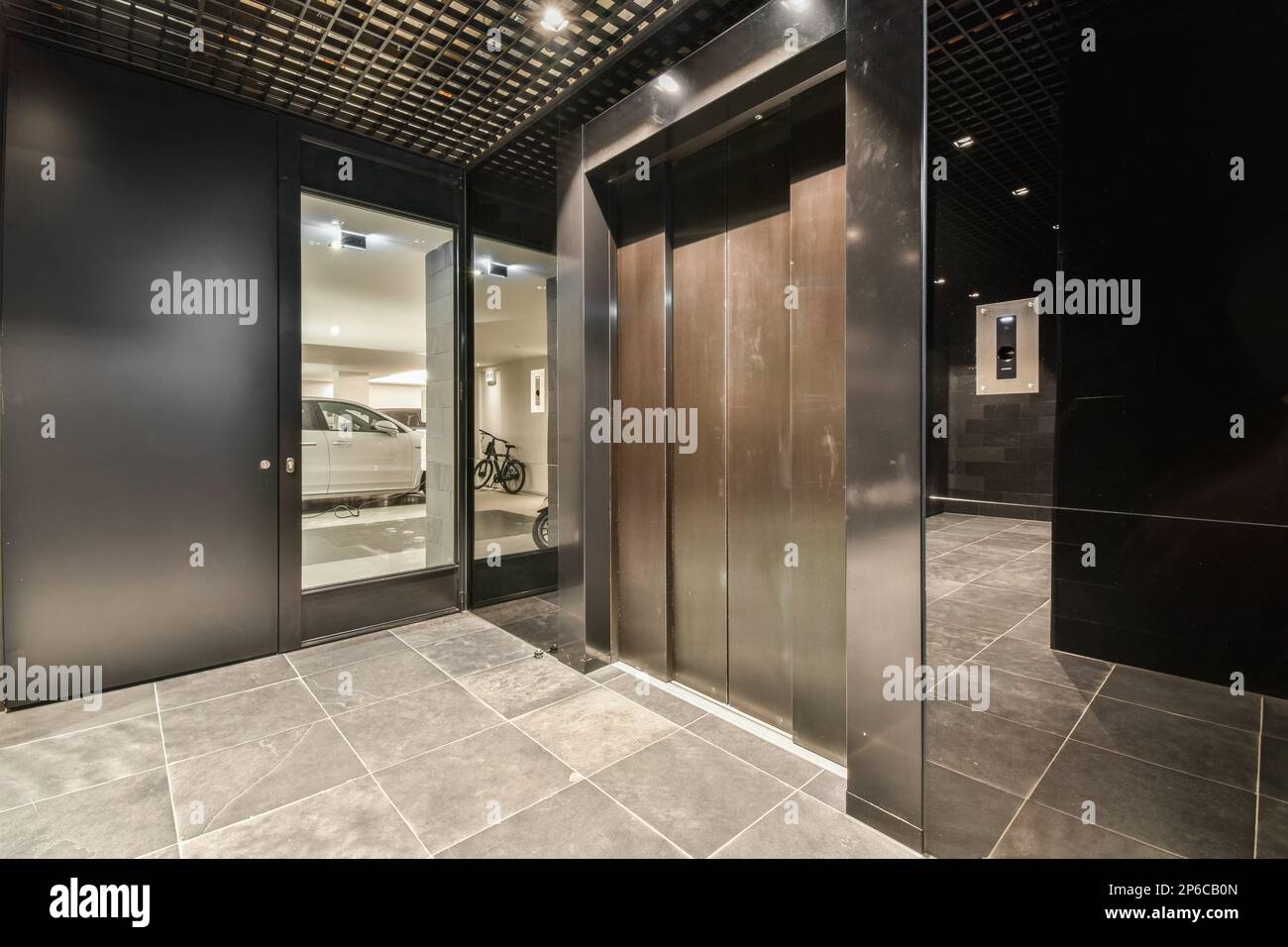 the inside of a building with two doors and one door opened to reveal a ...