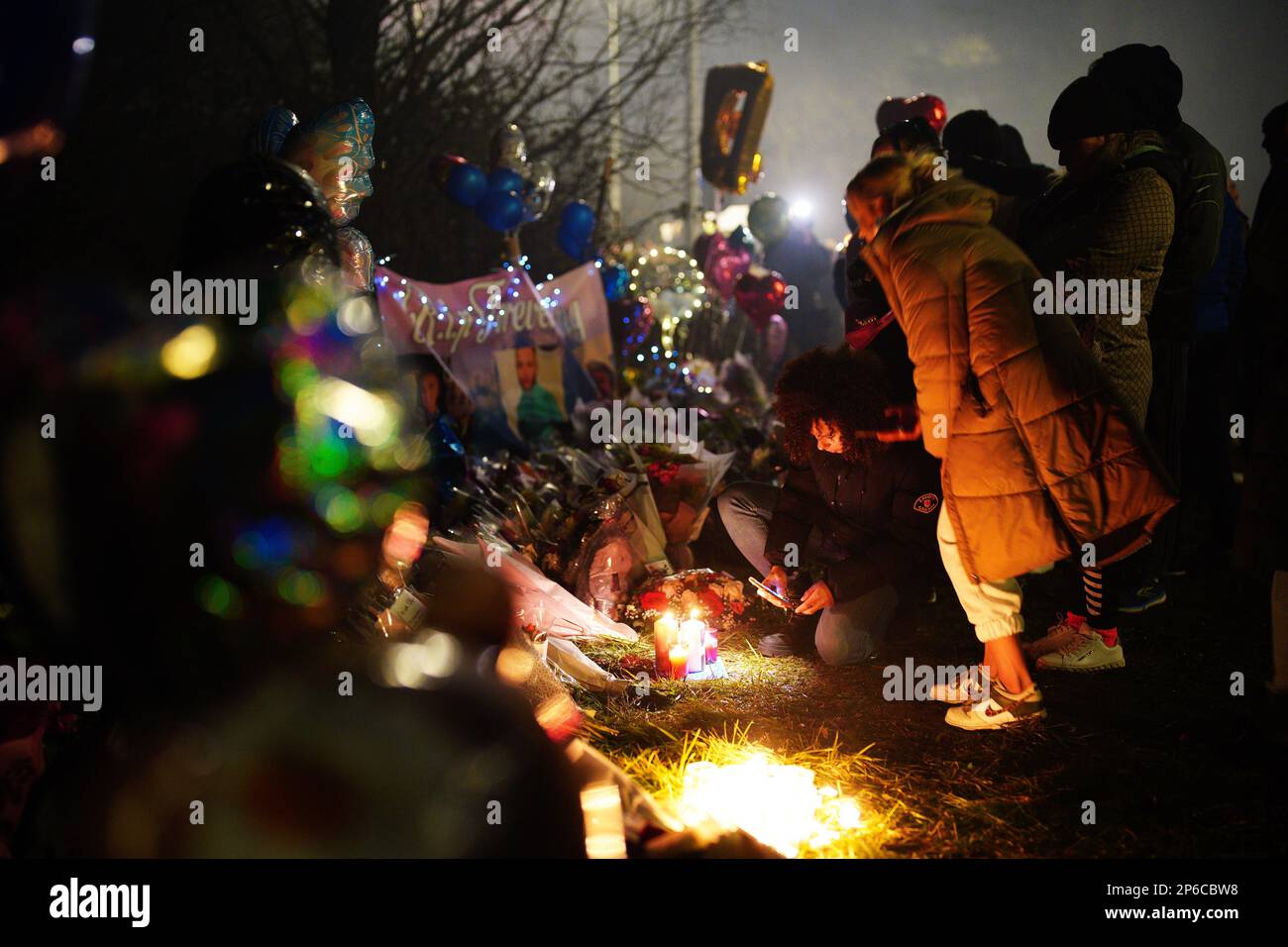People attend a vigil in the St Mellons area of Cardiff, in memory of ...