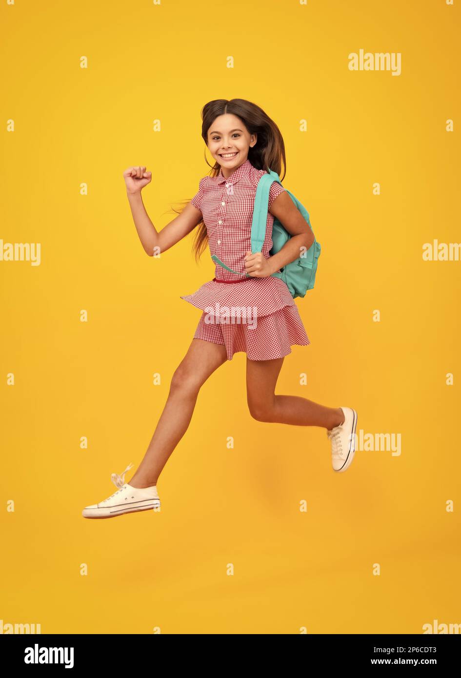 Schoolgirl in school uniform with school bag. Schoolchild, teen student ...
