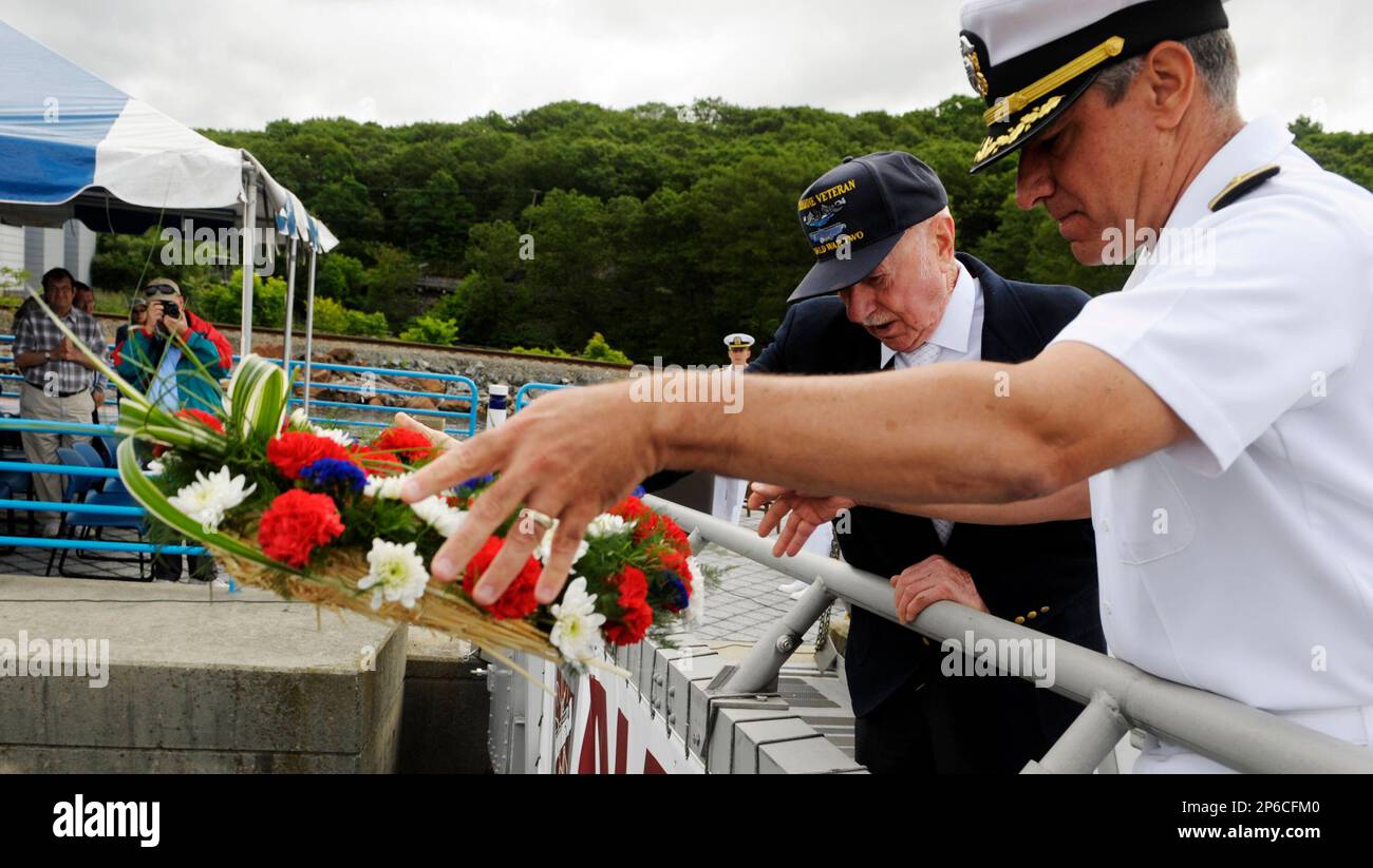 U.S. Navy Captain Marc W. Denno, right, commander of the Navy Submarine ...
